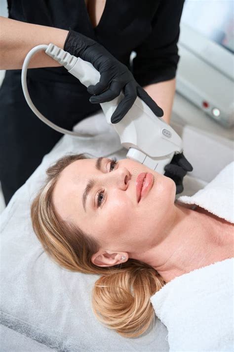 Client Lies On A Cosmetology Couch On Hardware Rejuvenation Procedure