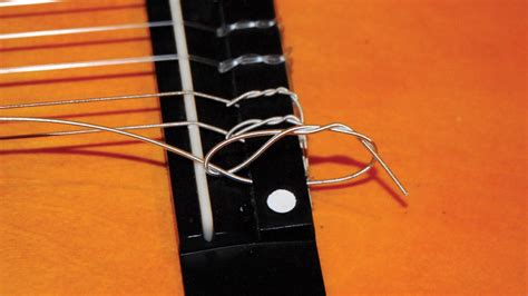Guitar Setup How To Restring A Nylon String Classical Guitar Musicradar