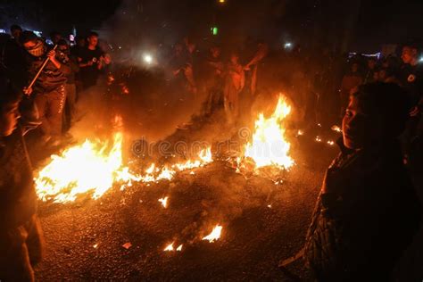 Palestinian Demonstrators Burn Tyres During A Protest Against Us