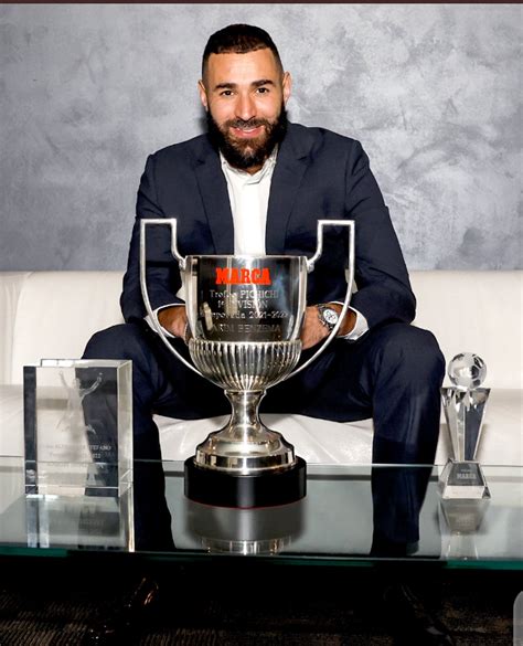 Real Madrid Star Karim Benzema Pose With Hat Trick Of Awards Including