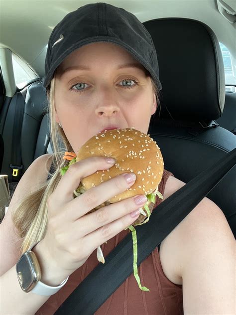 Face Of A Crazy Girl Who Is Stuffing Her Mouth With Mcdonals And Then