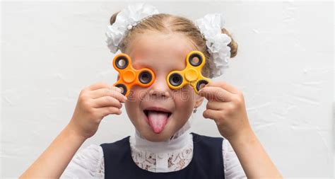 Girl With A Spinner In Studio Stock Photo Image Of Focus Face