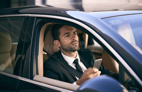 What Is With This Traffic A Handsome Young Businessman Sending A Text