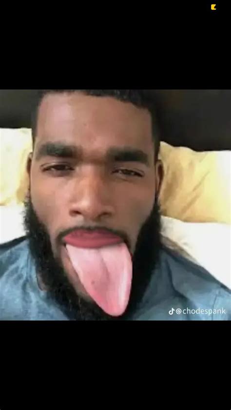 A Man Sticking His Tongue Out While Laying In Bed With The Caption That