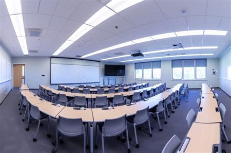 An Empty Classroom With A Projector Screen And Chairs A Panoramic View Of An Empty High Tech