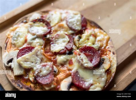 Pepperoni Pizza With Mozzarella Cheese White Mushroom And Sriracha