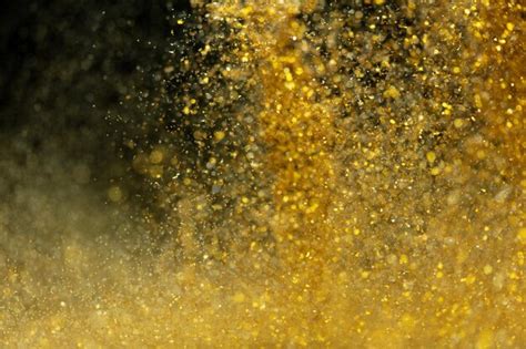 Premium Photo Explosion Metallic Gold Glitter Sparkle Golden Glitter Powder Spark Blink