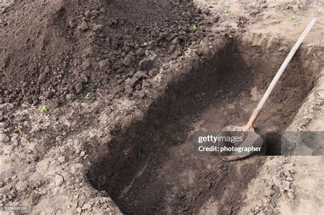 Digging A Pit Pit In The Ground The Shovel In The Pit High Res Stock