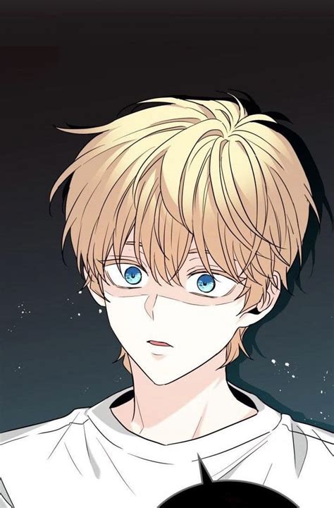 A Man With Blonde Hair And Blue Eyes Is Staring At The Camera While