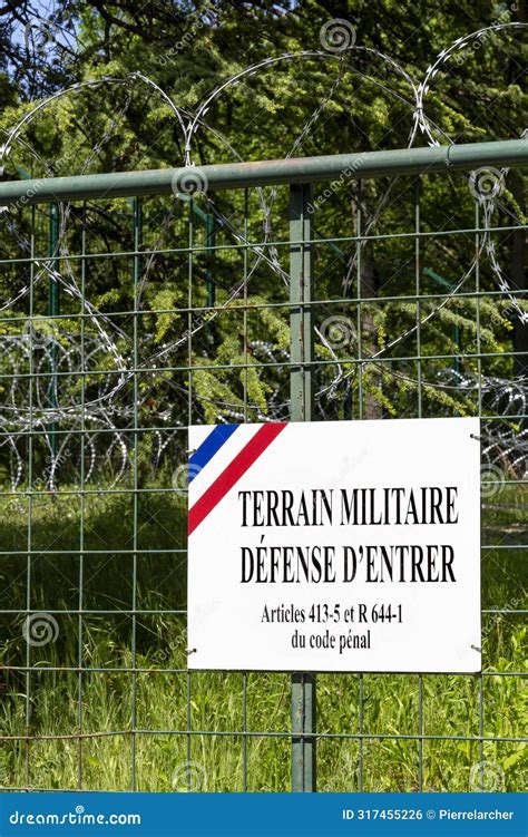 Close Up Of A No Trespassing Sign With A Fence Background Sign