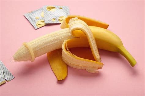Premium Photo Condom And Banana On Pink Background With Copy Space