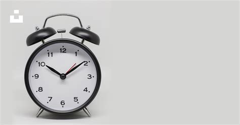 A Black And White Alarm Clock On A White Background Photo Free Alarm