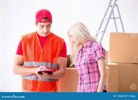 The Young Delivery Assistant Delivering To Home Stock Image Image Of