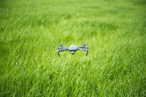 premium photo drone hovering above field
