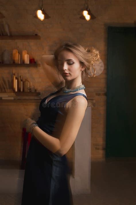 Glorious Young Woman With Long Curly Hair With Bare Shoulders Stock