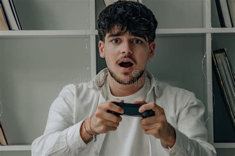 Male At Home With Joystick Playing Video Games Stock Image Image Of