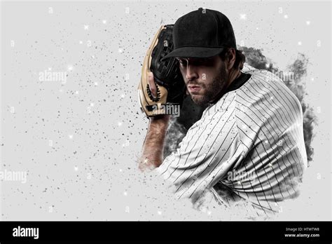 Pitcher Baseball Player With A White Uniform Coming Out Of A Blast Of