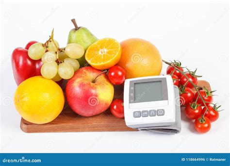 Blood Pressure Monitor And Fruits With Vegetables Concept Of