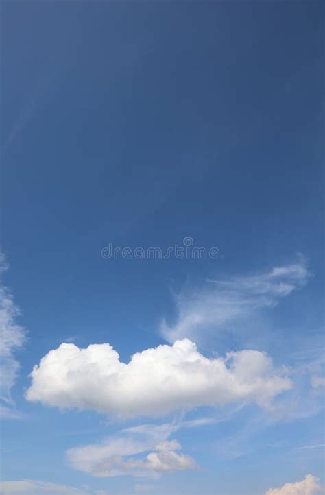 Sky With A Soft White Cloud And Space Above For Inserting Custom Text In A Vertical Layout Stock