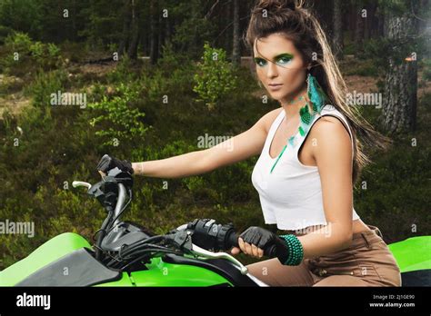 Stylish And Beautiful Woman And The ATV Stock Photo Alamy