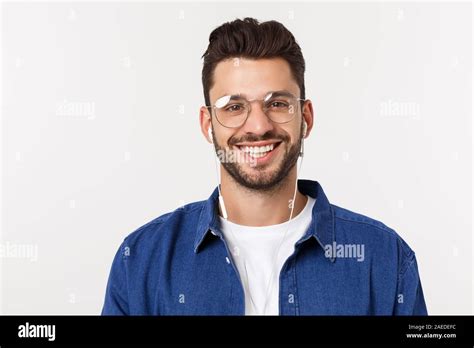 Portrait Of The Young Happy Smiling Handsome Man Isolated On A White