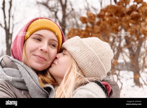 Teenage Girl Embracing Mother With Closed Eyes Stock Photo Alamy