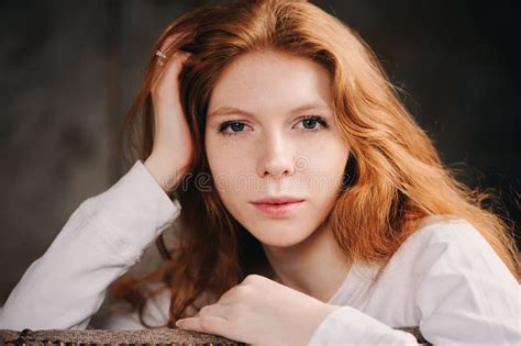 Close Up Indoor Portrait Of Adorable Thoughtful Young Redhead Woman