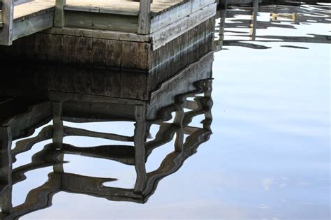Premium Photo Reflection Of Building In Puddle