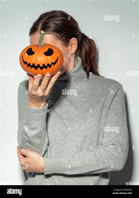 Crop Unrecognizable Woman Holding Halloween Scary Face Bright Orange