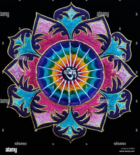 Multicoloured Hindu Om Aum And Lotus Flower Embroidery Pattern Stock