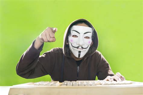 Hacker With Vendetta Mask And Threatening Gesture Editorial Photography