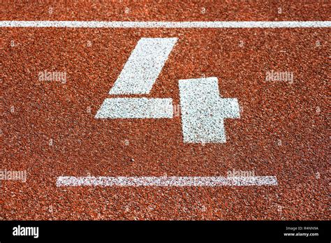 Start Number Four At Cinder Track Of Track And Field Running Track
