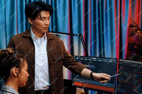 Premium Photo It Developers Discussing With Point Website Coding System Infobahn