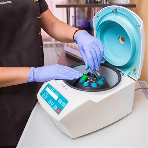 Premium Photo A Person In A Lab Wearing Purple Gloves Is Using A