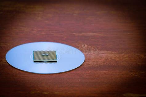 A Square Computer Processor Pulled From A Broken Computer The Processor Is On The Table Stock