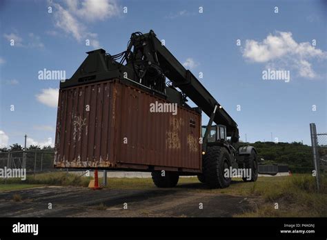 The 390th Spoc Soldiers Moved 11000 Pound Containers Onto The Lcm By Utilizing A Rough Terrain