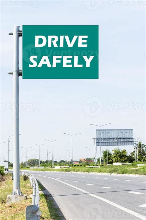 Message Drive Safely On Green Road Sign With Highway Road View 21152686