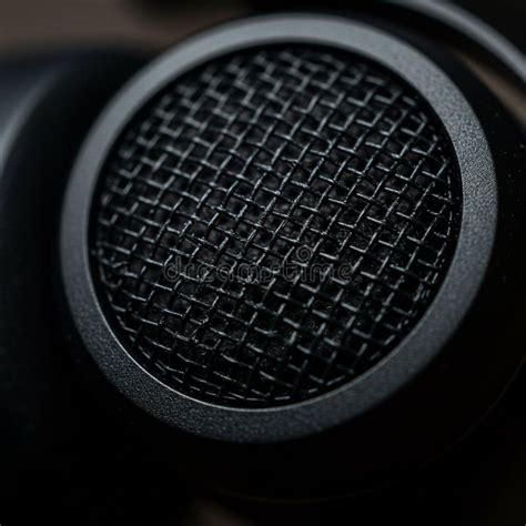 Close Up Of A Black Mesh Speaker Grille With A Circular Design The