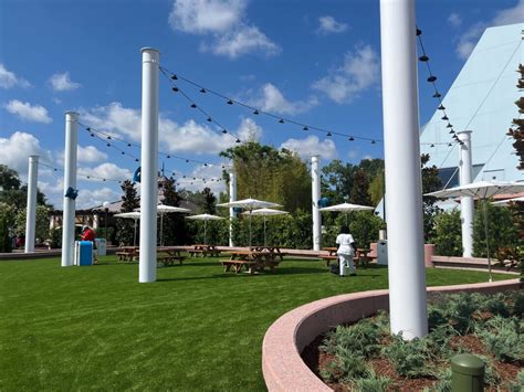 EPCOT Flex Space Opens With Picnic Tables Umbrellas Disney By Mark