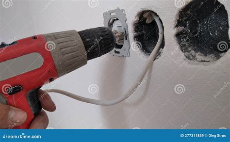 Installation Of The Main Part Of The Electrical Socket In The Box In