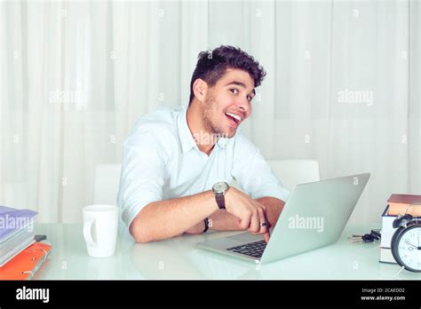 Happy Adult Man Looking Excitedly At Camera While Pushing Enter Button On Laptop Keyboard At