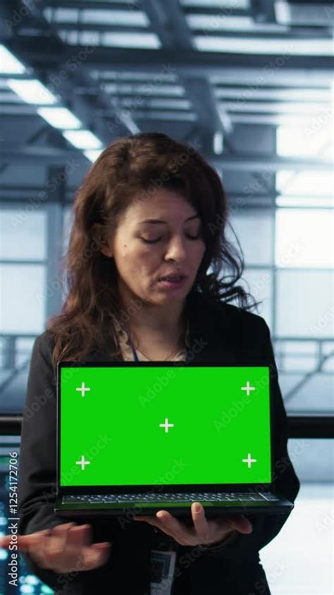 Vertical Video Data Center It Team Automating Routine Maintenance Tasks With Green Screen Laptop
