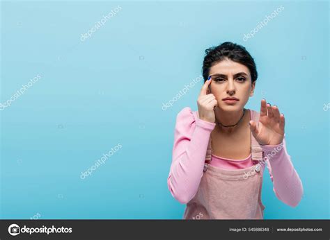 Myopic Woman Touching Eye While Looking Camera Isolated Blue — Stock