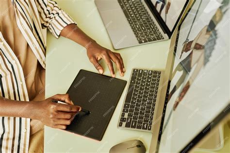 Premium Photo Hands Of Skilled Graphic Designer Drawing Pictures With Stylus And Tablet While