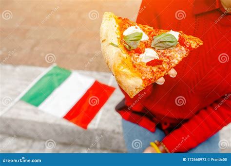 Woman Eating Pizza Slice In Italy Outdoors Travel In Europe And