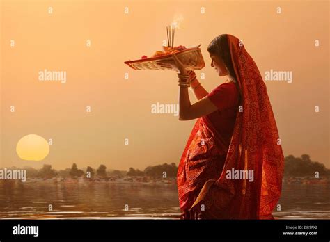 Woman From Bihar Offers Prayers To The Sun In The Early Morning Hours
