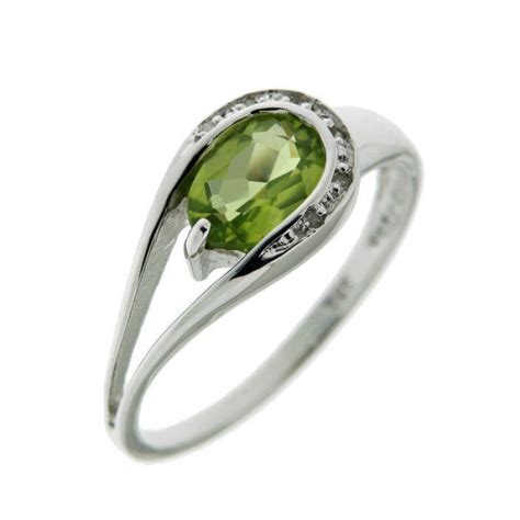 Bague Or Blanc Péridot Ovale x mm et Diamant Ref