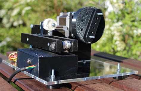 An Old Camera Sitting On Top Of A Wooden Table