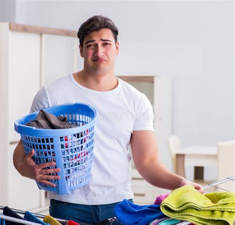 Man Doing Laundry At Home Stock Image Image Of Clothes 260917891