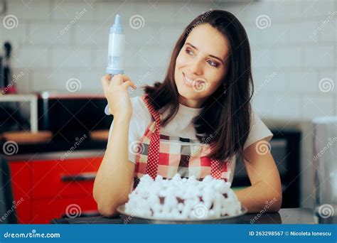 Happy Home Cook Frosting Her Cake With A Decorating Tool Stock Image
